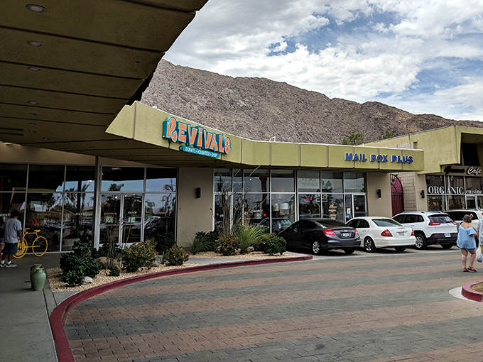 Where mountain majesty meets thrift store magic. This Revivals location sits like a retail oasis against the dramatic backdrop of Palm Springs' peaks.
