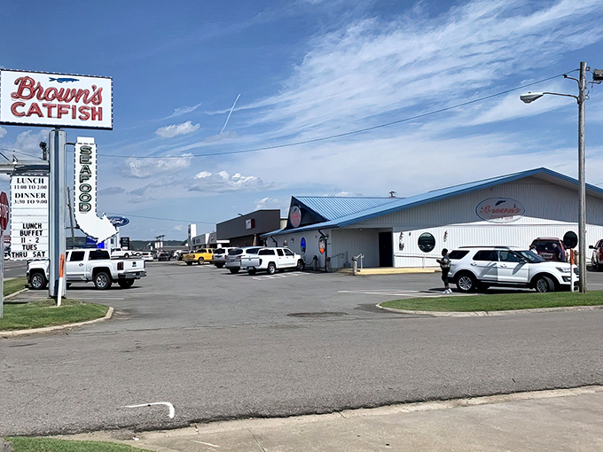 The parking lot tells the first chapter of the story&mdash;a mix of vehicles united in pursuit of the same treasure that lies behind those blue-trimmed doors.