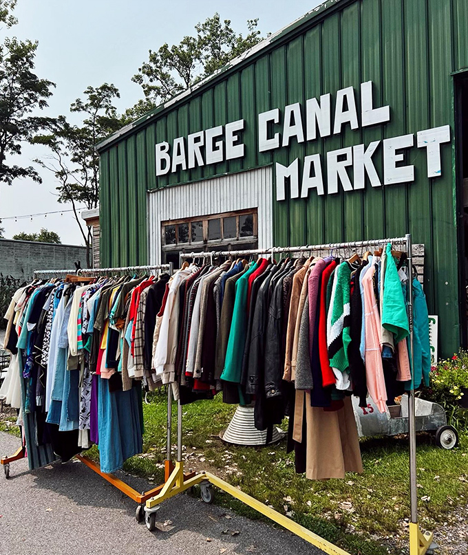 The outdoor clothing rack offers a rainbow of vintage fashion possibilities, proving that treasure hunting begins before you even enter.