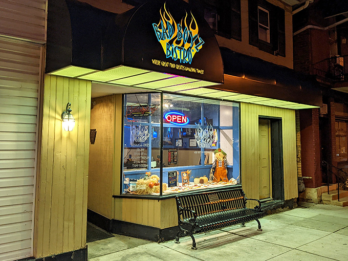 At night, the illuminated storefront glows like a lighthouse for the hungry, promising safe harbor from mediocre meals in downtown Bedford.