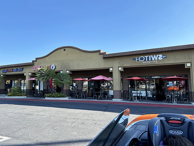 Strip mall location, destination-worthy food. The palm trees and red umbrellas create that quintessential California vibe that pairs perfectly with world-class BBQ.