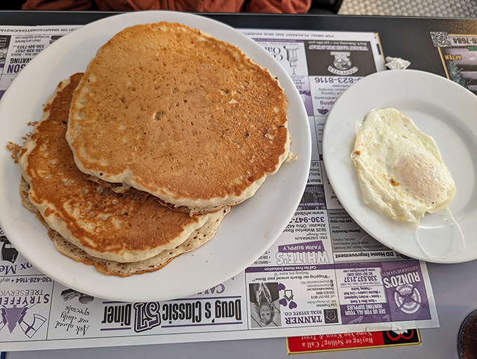 Pancakes the size of dinner plates with that perfect golden-brown hue. Add a sunny-side-up egg, and you've got the breakfast equivalent of winning the lottery. 