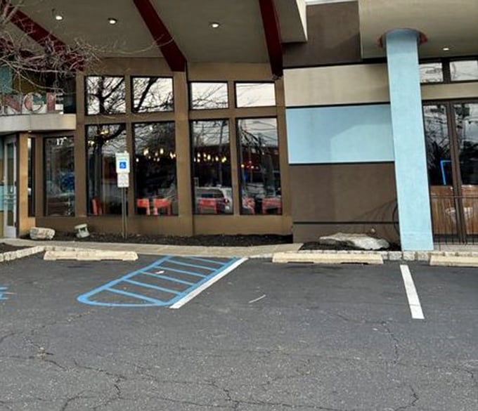 The entrance welcomes you with clean lines and large windows, offering a glimpse of the culinary adventure that awaits inside.