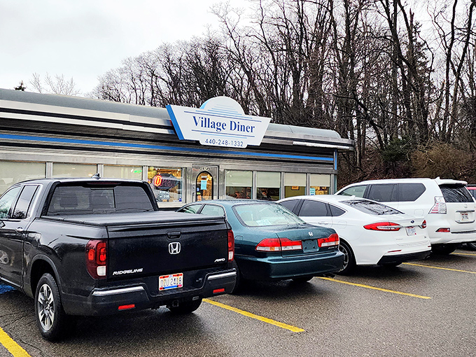 Even on a gray Ohio day, the Village Diner's sign shines like a beacon of breakfast hope. Your diet plan can resume tomorrow.