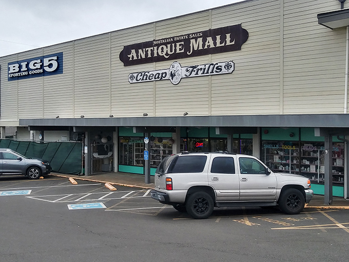 The sign promises "Antique Mall" and "Cheap Frills," delivering both with the unpretentious charm that makes Newport special.