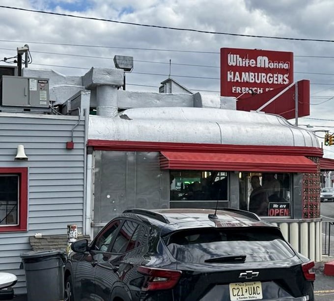 Even from the parking lot, that sign promises satisfaction. Cars from across the tri-state area make the pilgrimage to this temple of burger perfection.
