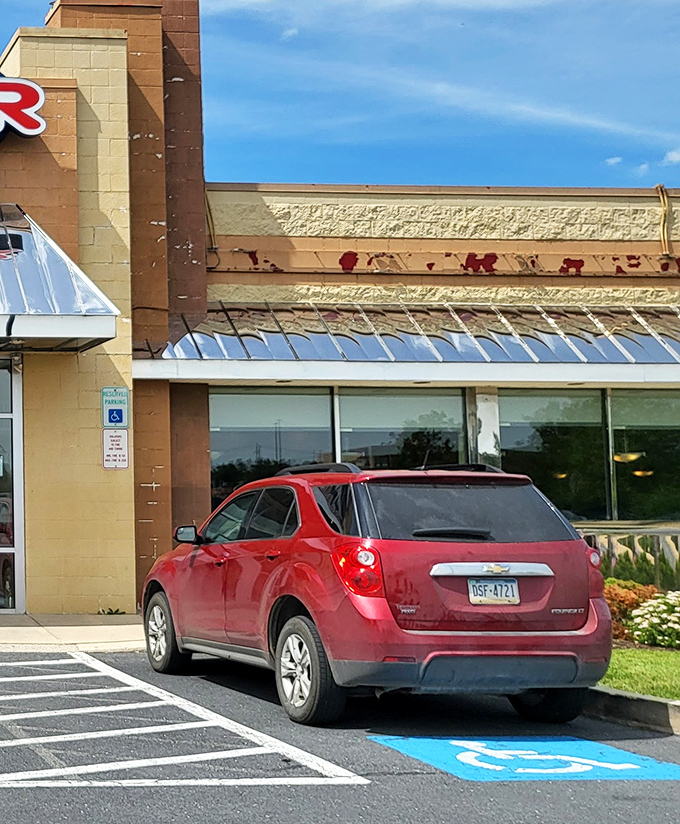 Even the parking spots seem to say "Welcome!" Red car optional, but a healthy appetite is absolutely required for what awaits inside.