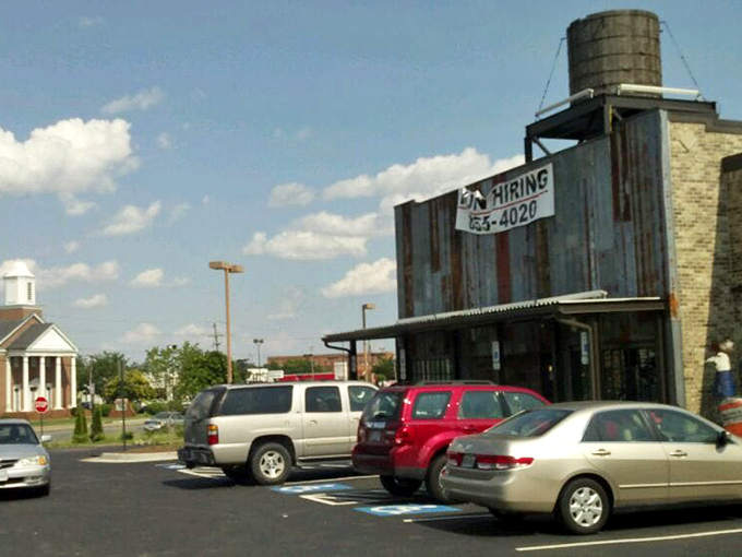 A parking lot that's seen license plates from across the country. Cars arrive hungry and leave with satisfied passengers and lingering aromas.