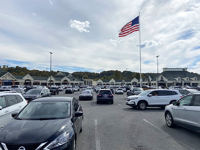 The vast parking lot, a sea of vehicles under Tennessee sky. That American flag isn't just patriotic&mdash;it's a landmark for remembering where you parked.