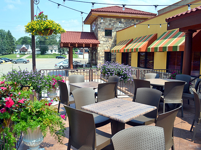 The flower-adorned patio offers al fresco dining where summer breezes complement your wine, and pasta tastes even better under string lights.