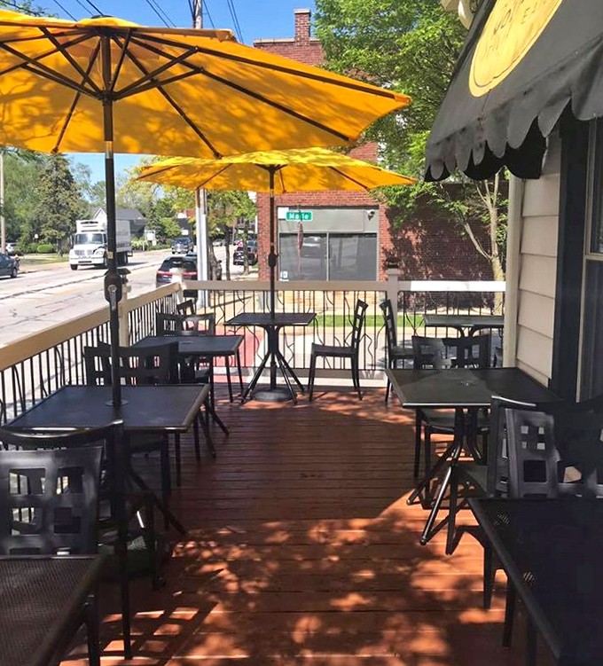The patio offers front-row seats to Lakewood life, where yellow umbrellas provide shade for conversations that flow as easily as the wine. 