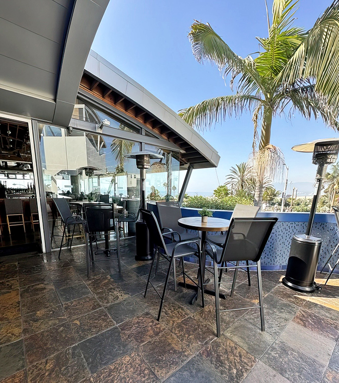 Outdoor dining with a side of ocean breeze. This patio offers the quintessential California experience &ndash; sunshine, palm trees, and the promise of lobster.