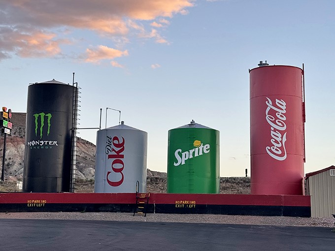 Sunset bathes the giant cans in golden light, transforming this quirky roadside attraction into something unexpectedly beautiful.