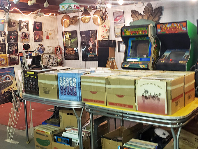 Vinyl paradise for music lovers who know albums weren't meant to be streamed. Those vintage arcade games in the background? Double the nostalgia points.