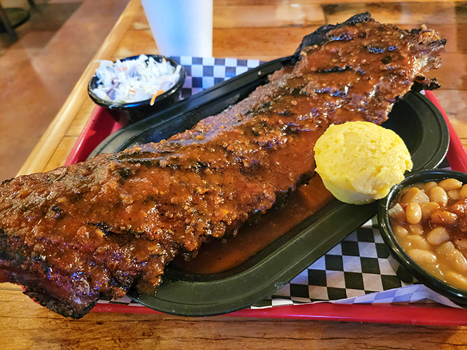 The rack of ribs that launches a thousand napkins. This glistening masterpiece with its perfect char is what BBQ competitions dream about.