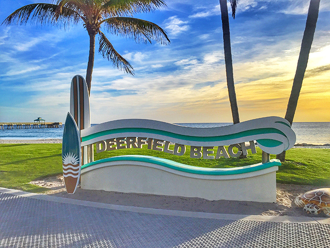 The entrance sign says "Deerfield Beach" but really means "You've arrived at your better life." Sunset included at no extra charge.