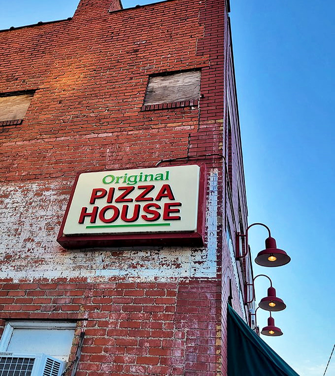 The weathered sign tells a story of longevity&mdash;in a world of constant restaurant turnover, Police Station Pizza has stood the test of time and taste.