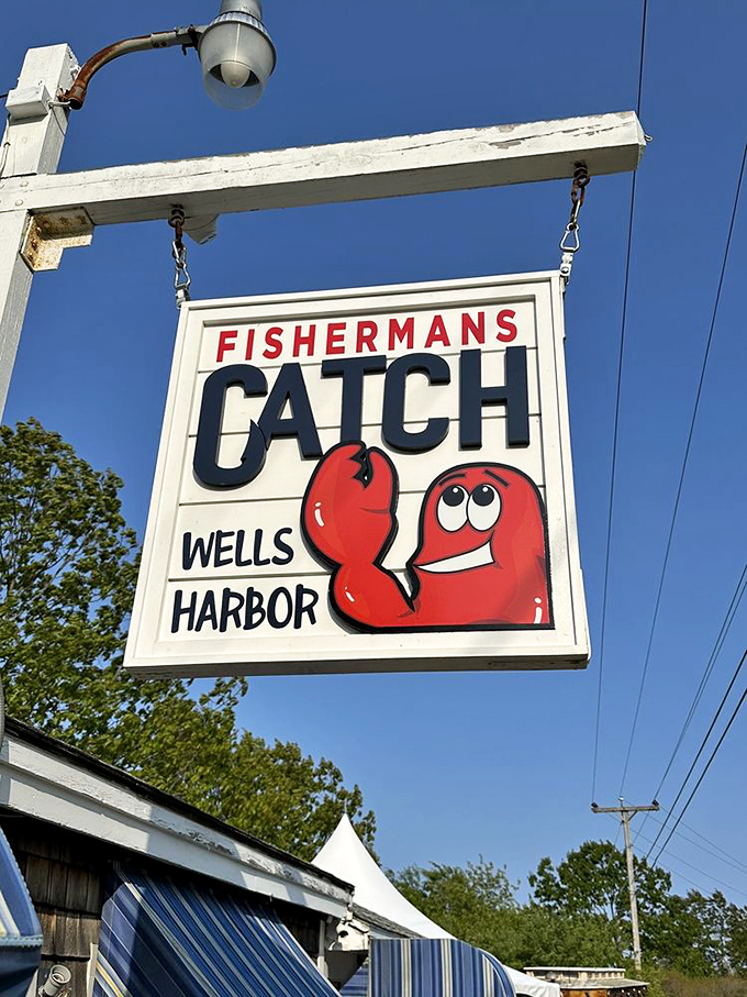 The cheerful sign featuring their cartoon lobster mascot&mdash;like a maritime version of Mickey Mouse welcoming you to the happiest place in Wells Harbor.