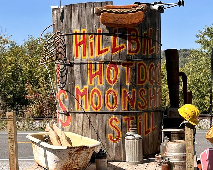 The iconic moonshine still sign announces you've arrived at hot dog heaven. Not just a restaurant sign&mdash;it's a beacon of quirky Appalachian ingenuity.