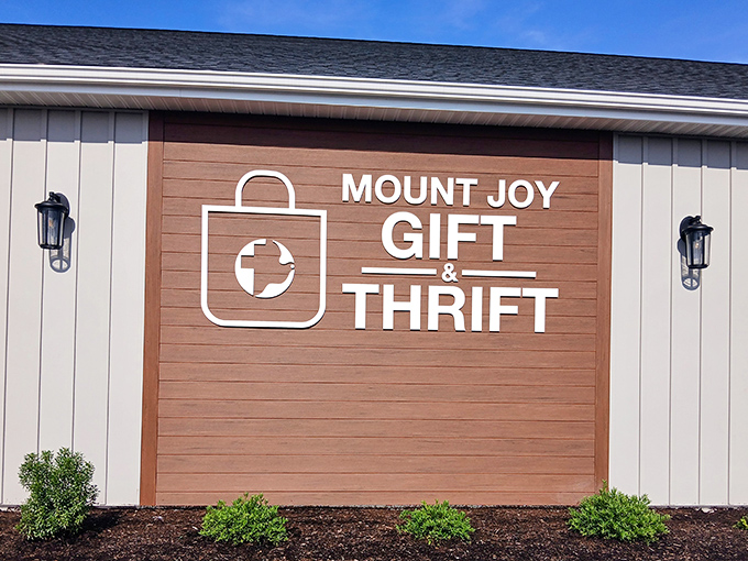The sign says "Gift & Thrift" but should add "& Treasure Hunt." Like the Hollywood sign for bargain hunters, it beckons with promises of discovery.