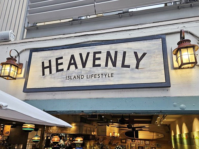 The sign glows like a beacon at dusk, transforming from "restaurant" to "destination" as the Hawaiian evening settles in.