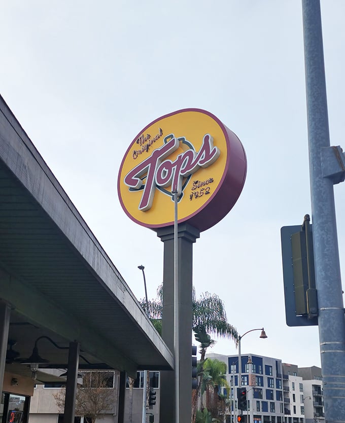 The sign that launched a thousand cravings. In a city of trendy eateries, this yellow beacon promises something more valuable: consistency.