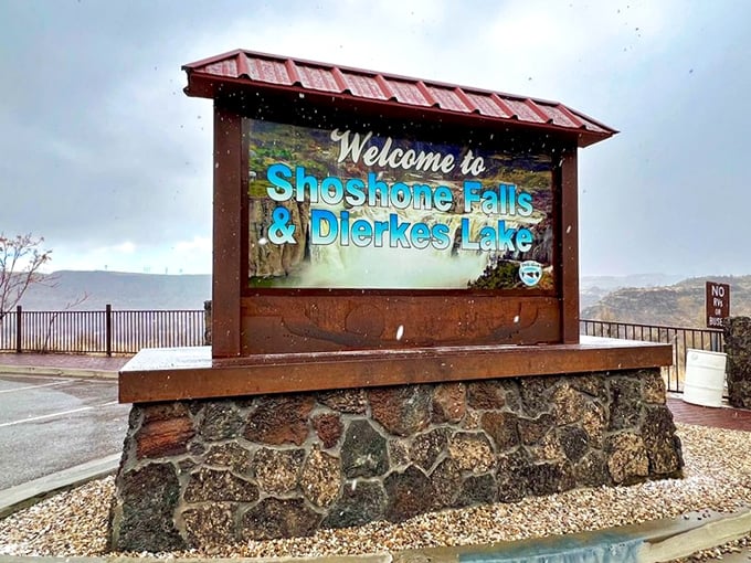 Snow dusts the welcome sign in winter's gentle reminder that Shoshone Falls is a year-round affair. Every season brings its own magic.