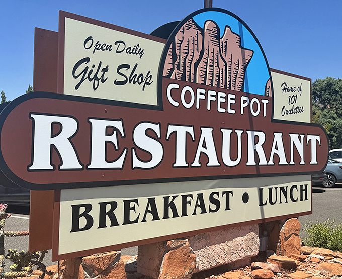 That roadside sign announces breakfast and lunch daily&mdash;your beacon of hope on Highway 89A's breakfast landscape.
