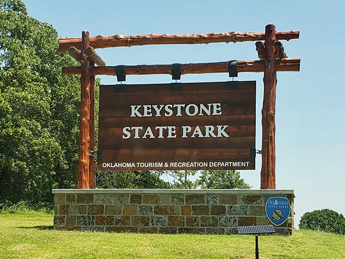 The gateway to adventure doesn't need neon lights. Keystone's entrance sign promises natural wonders just beyond the parking lot.