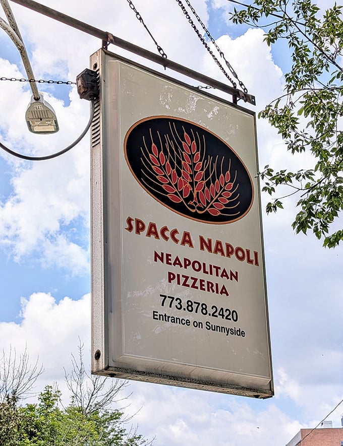 The beacon that guides hungry pilgrims &ndash; Spacca Napoli's vintage-style sign promises authentic Neapolitan pizza to those wise enough to follow its call.