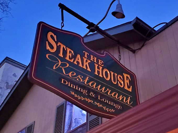 The illuminated sign glows like a beacon in the Pennsylvania twilight, guiding hungry travelers to their carnivorous destiny.