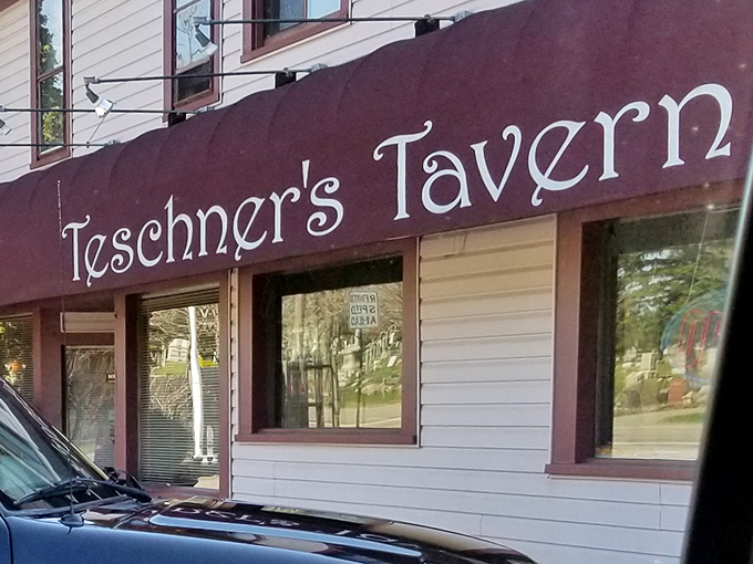 That sign isn't just lettering on a window - it's a beacon calling hungry souls to burger paradise.