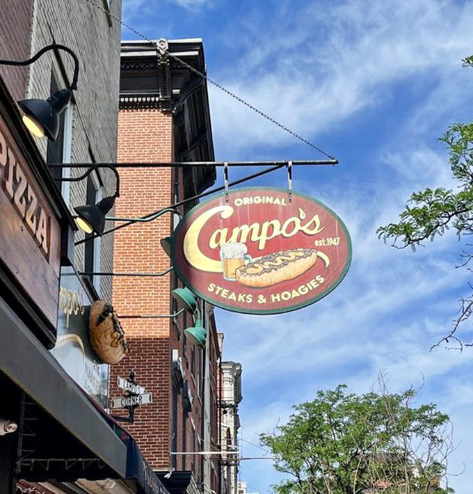 Campo's vintage sign against the Philadelphia sky &ndash; a beacon of hope for the hungry that's been guiding sandwich pilgrims for generations.