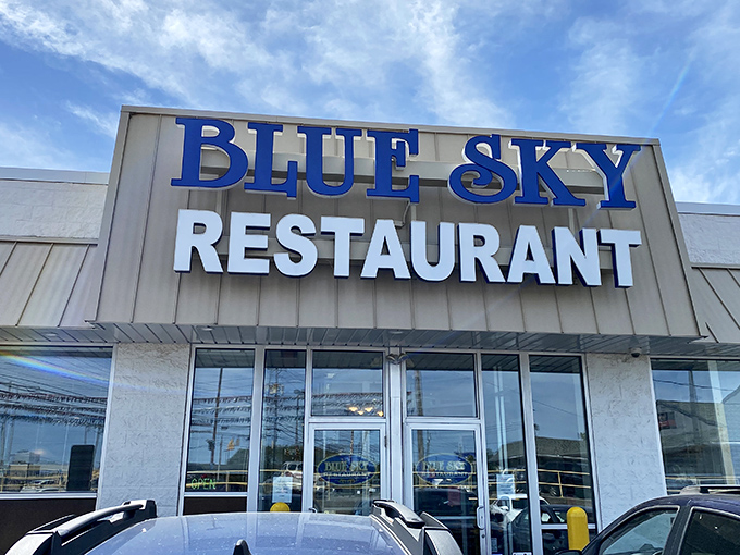 The bold blue lettering against the bright sky creates a perfect namesake moment—as if the restaurant and heavens coordinated their color scheme.