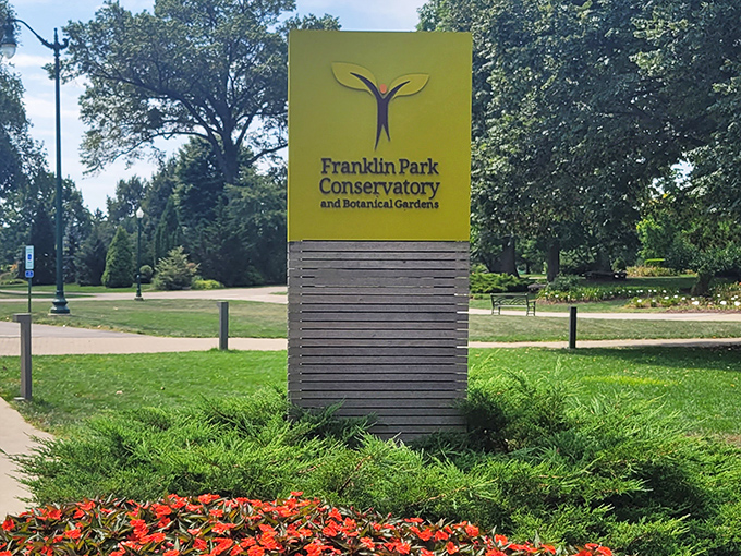 The yellow sign that promises green adventures. Franklin Park Conservatory's welcome mat is surrounded by nature's most vibrant calling card.