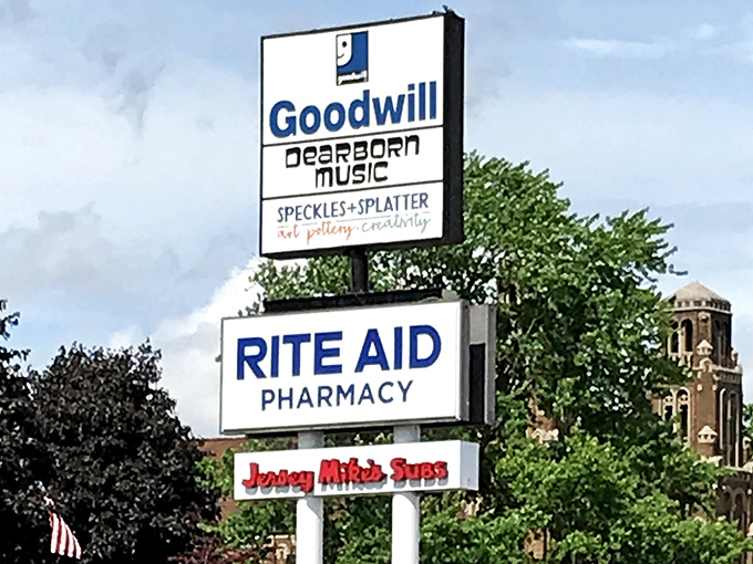 The sign announces "Speckles + Splatter," proving even Goodwill neighbors appreciate a good creative mess.