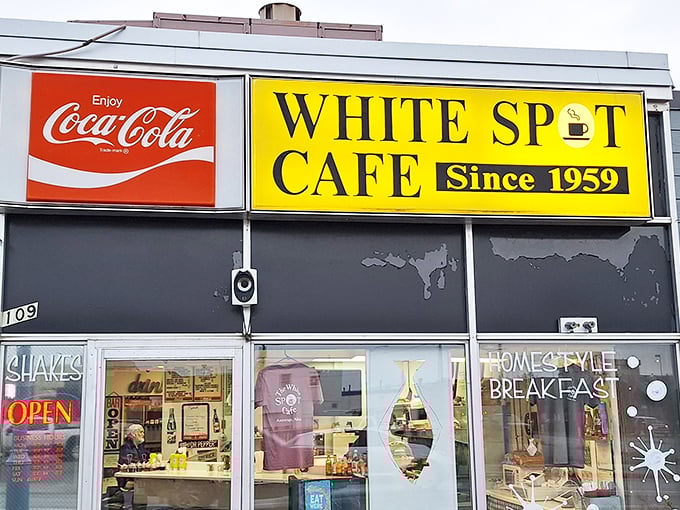 That Coca-Cola sign and yellow beacon work together like bacon and eggs &ndash; classic American breakfast diplomacy at work.