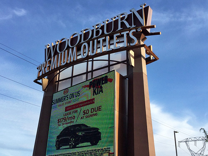 The beacon of bargains illuminates the Oregon sky, guiding shoppers to the promised land of discounted designer goods.