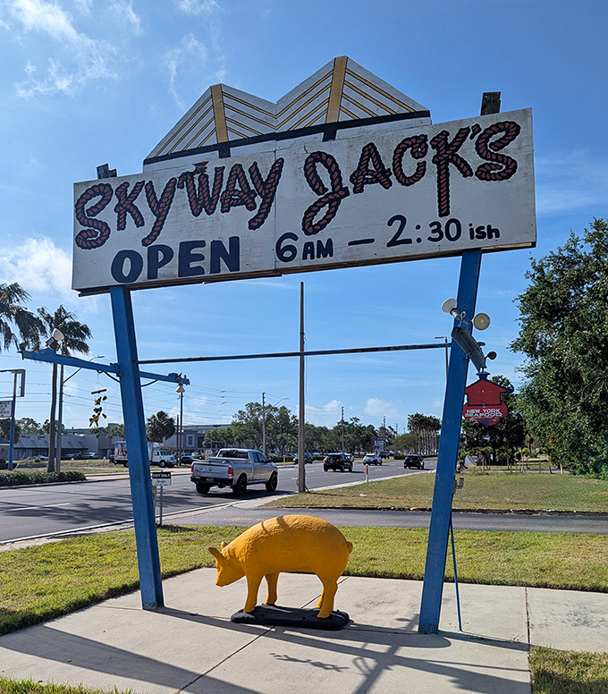 "Open 6AM - 2" &ndash; the most honest business hours sign in Florida, complete with a golden pig for good measure.