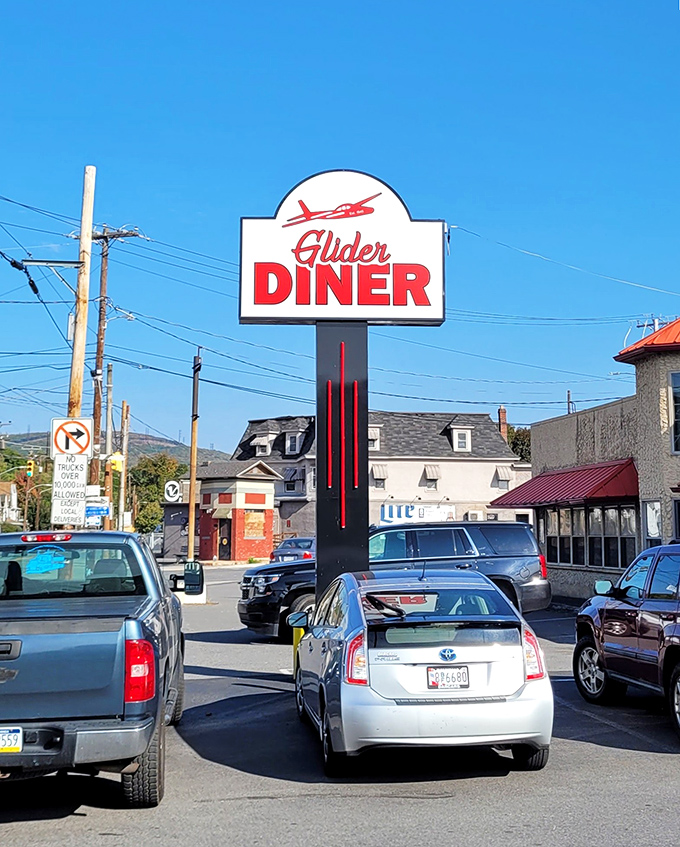 The roadside sign stands tall against the Pennsylvania sky, promising delicious refuge from highway monotony just a turn away.