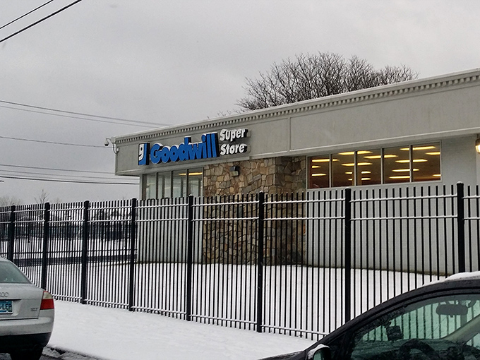 Even in winter's embrace, the Goodwill Super Store stands ready, its blue sign a beacon of bargains against the gray Connecticut sky.