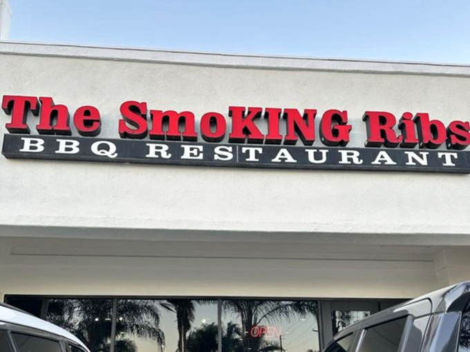 That sign isn't just announcing a restaurant&mdash;it's a beacon for the barbecue faithful, a promise of smoky salvation in strip mall form. 