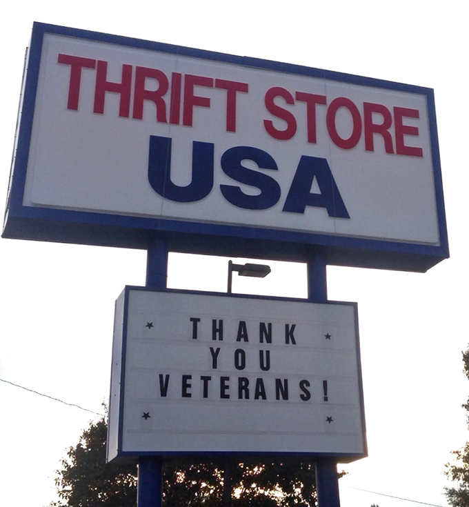 The roadside marquee thanks veterans while beckoning bargain hunters&mdash;patriotism and thrift shopping under one sign.
