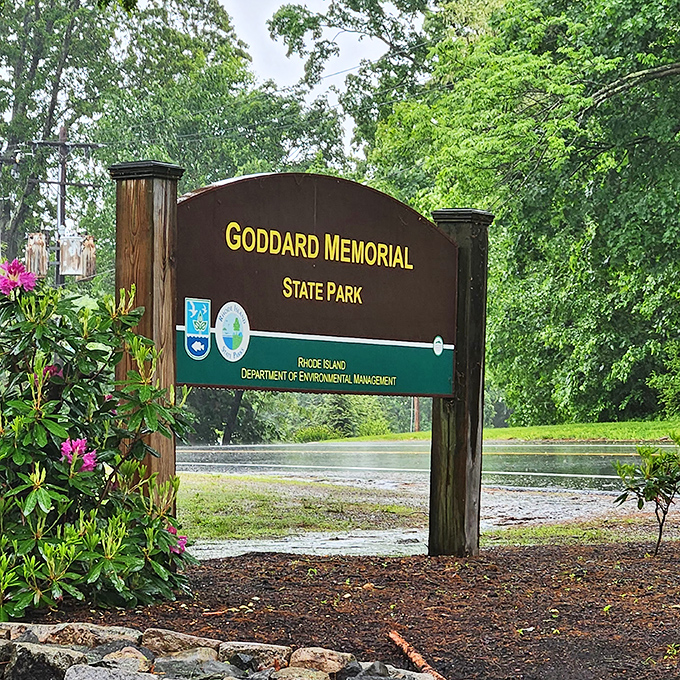 Gateway to tranquility: The unassuming entrance sign belies the natural wonders waiting just beyond, where Rhode Island's best-kept secret unfolds.