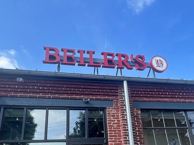 That iconic red sign against the blue Pennsylvania sky—a beacon of hope for the hungry and a landmark for the doughnut-obsessed.