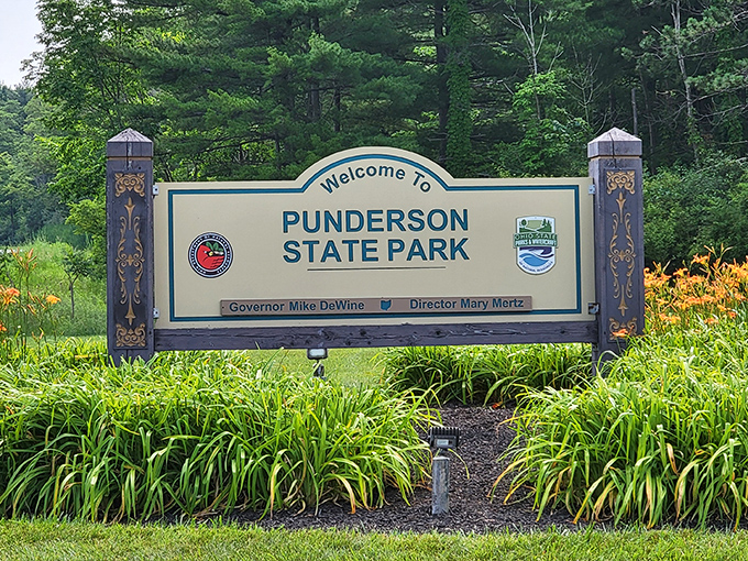 The welcoming sign to Punderson State Park &ndash; your official invitation to temporarily trade spreadsheets and schedules for trails and tranquility.