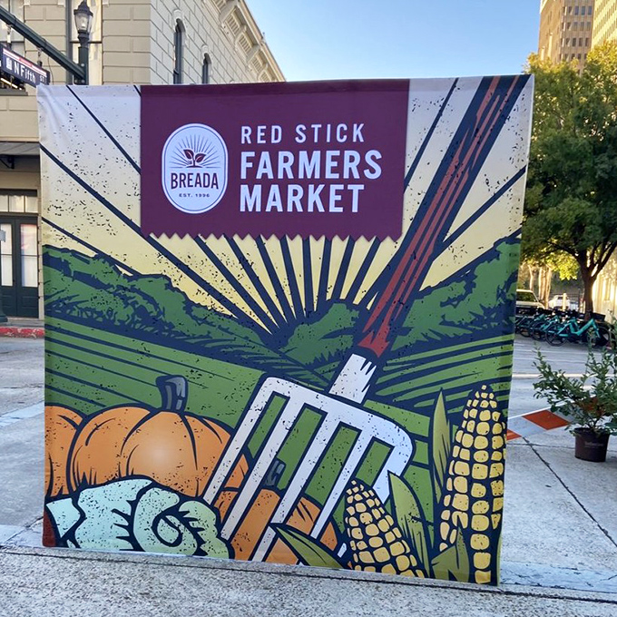 The market's iconic sign stands as a colorful beacon to food pilgrims. This isn't just shopping—it's a Saturday morning religion for Baton Rouge's culinary faithful.