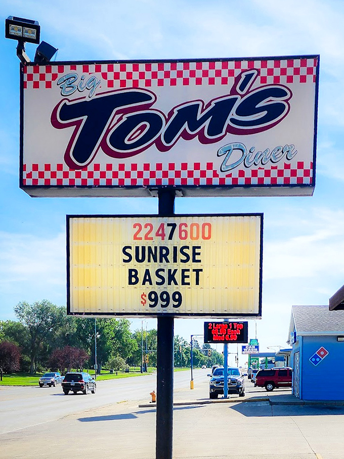 The iconic Big Tom's sign announces daily specials – a roadside landmark that promises satisfaction ahead.