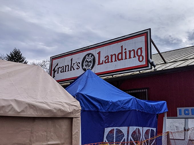 Frank's Landing sign stands sentinel above the market, promising the same excitement whether under cloudy skies or Pacific Northwest sunshine.