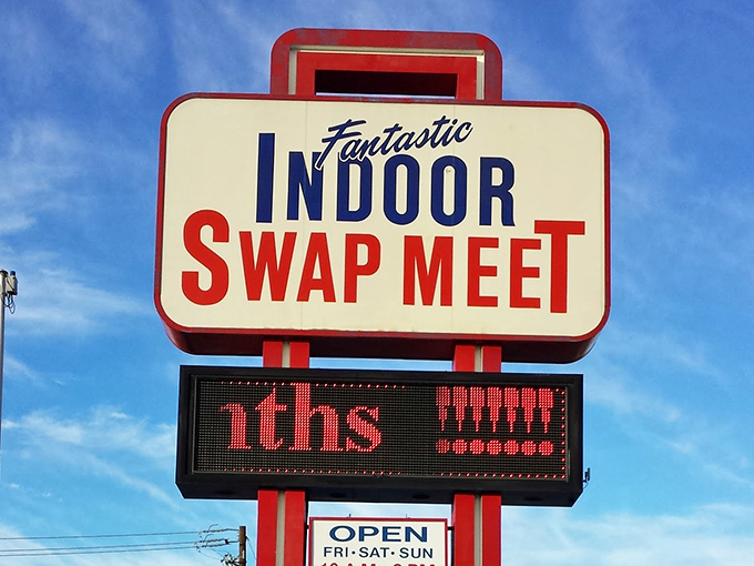 The iconic sign stands tall against the Nevada sky, promising three days weekly of treasure hunting that Vegas visitors rarely discover.